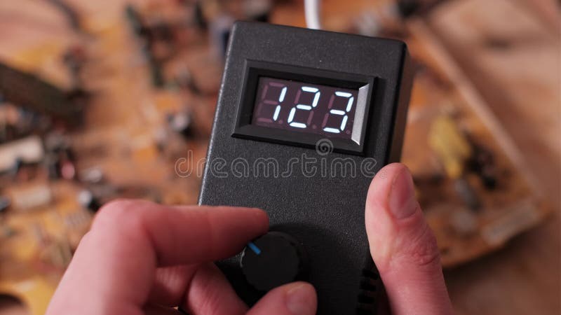 Hand Adjusting Voltage Regulator Digital Display Reading Stock Video ...