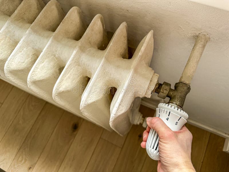 Hand Adjustment of the Heating Temperature on the Old Iron Radiator ...