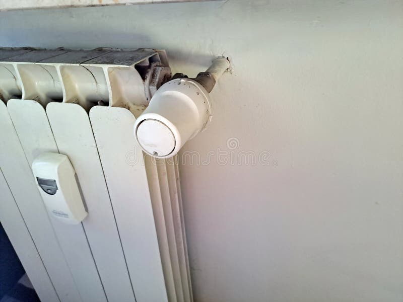 Hand Adjustment of Heating Temperature on the Radiator Stock Photo ...