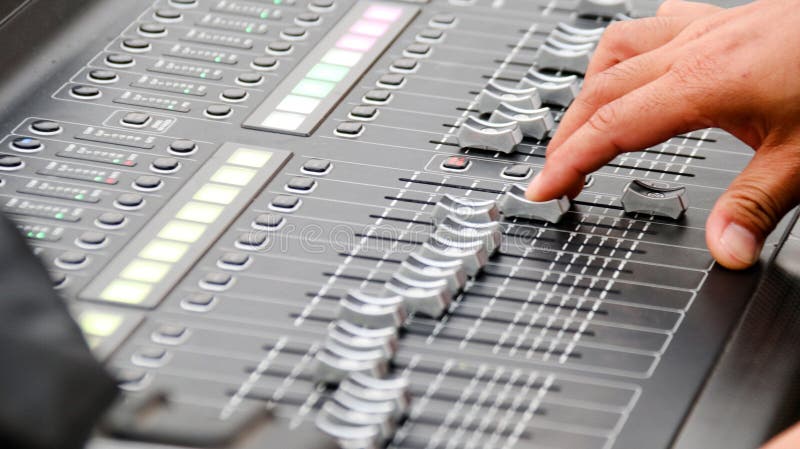 A Hand Adjusts the Control Knobs on a Grey-black Audio Mixer, Fine ...