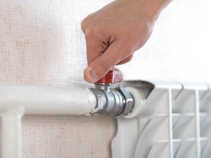 The Hand Adjusts the Radiator. Closeup Stock Photo - Image of hand ...