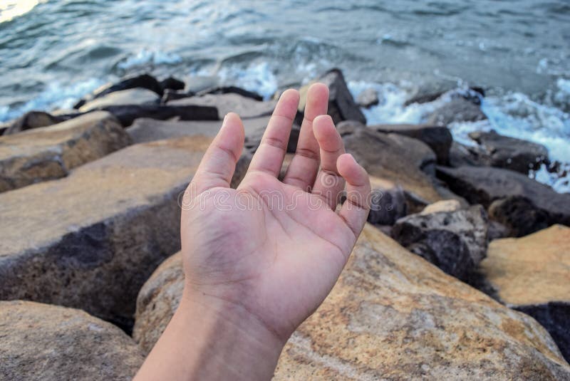 Hand, Air, Ocean , and Stone Stock Photo - Image of hand, ocean: 219281982