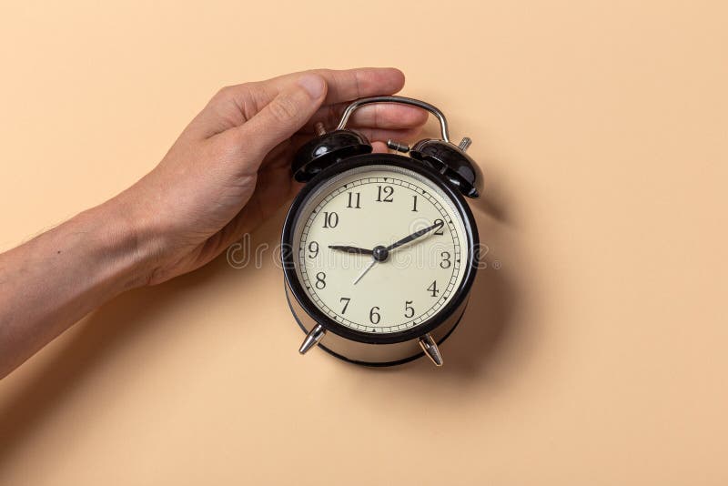 Hand with alarm clock stock image. Image of clock, alert - 225932687
