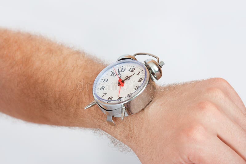 Hand with Alarm clocks stock image. Image of business - 55412787