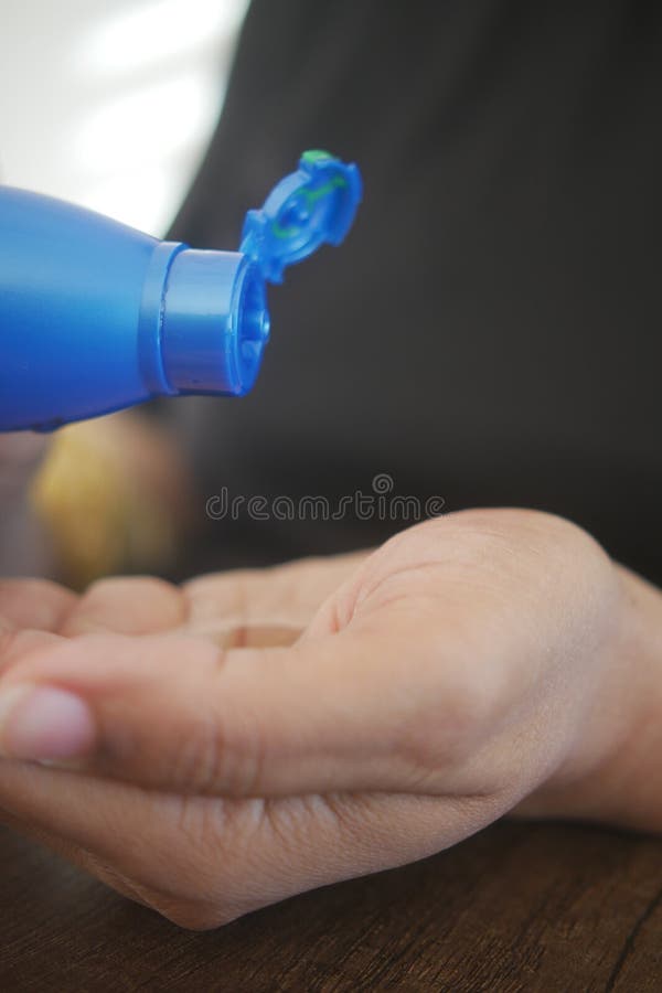 Hand Applying Hair Oil in a Bright Indoor Setting Stock Image - Image ...