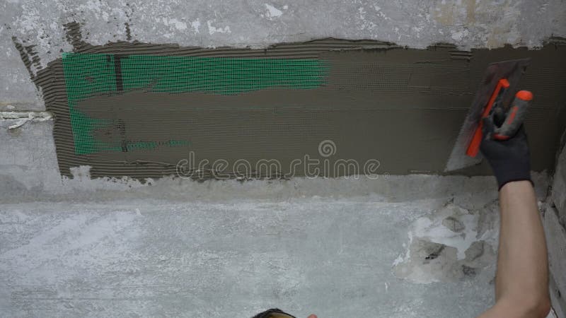 Hand Applying Plaster on Reinforcing Mesh on Ceiling Stock Footage ...