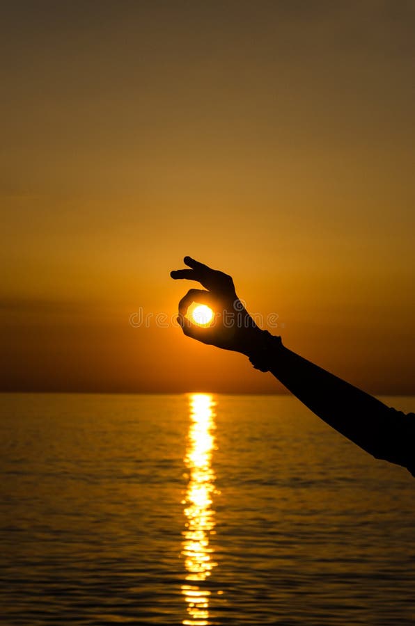 Hand around sun stock image. Image of fingers, idea - 184130943
