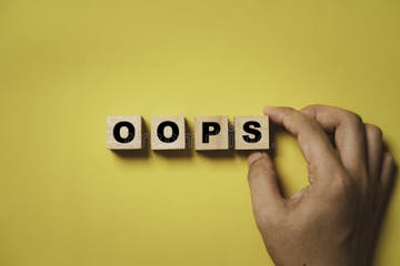 Hand Arrange Oops Wording on Yellow Background for Caution Warning Sign ...