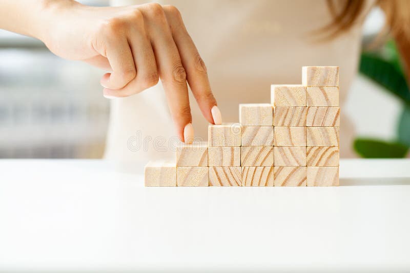 Hand Arranging Wood Cube Stacking As Stair Step Shape Stock Photo ...