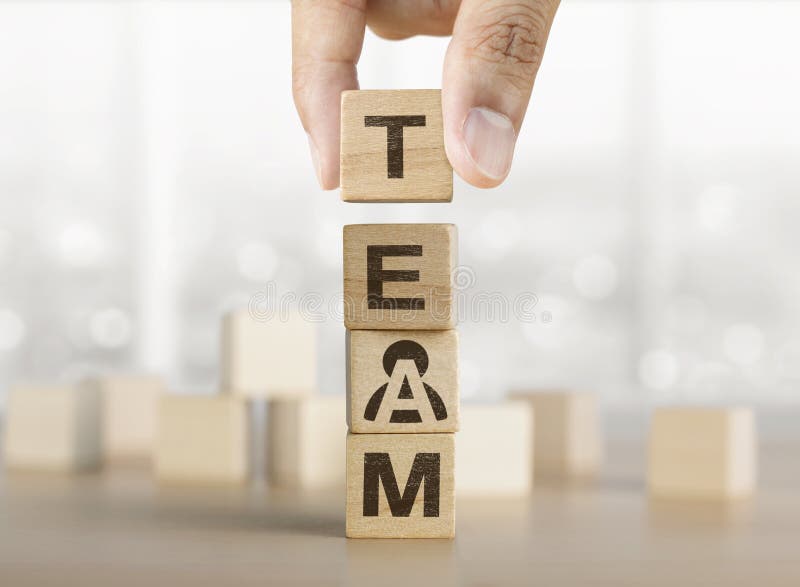 Hand Arranging Wooden Blocks with the Word TEAM. Team Work, Unity ...