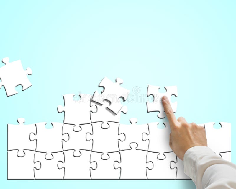 Hand Assembling Puzzles in Blue Background Stock Image - Image of ...