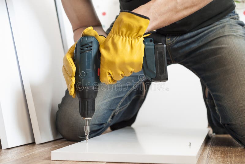 Hand assembly of furniture stock photo. Image of installation - 92027432