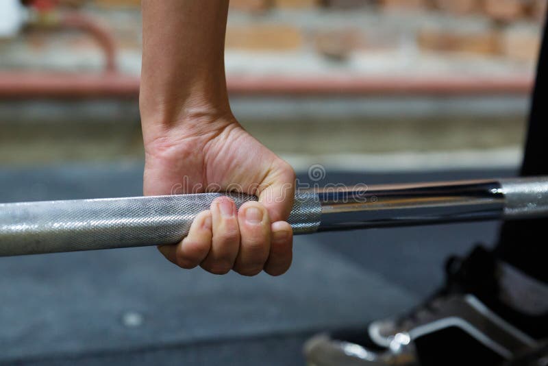 Hand Athlete Holding the Bar Neck. the Athlete Holds the Bar. Stock ...