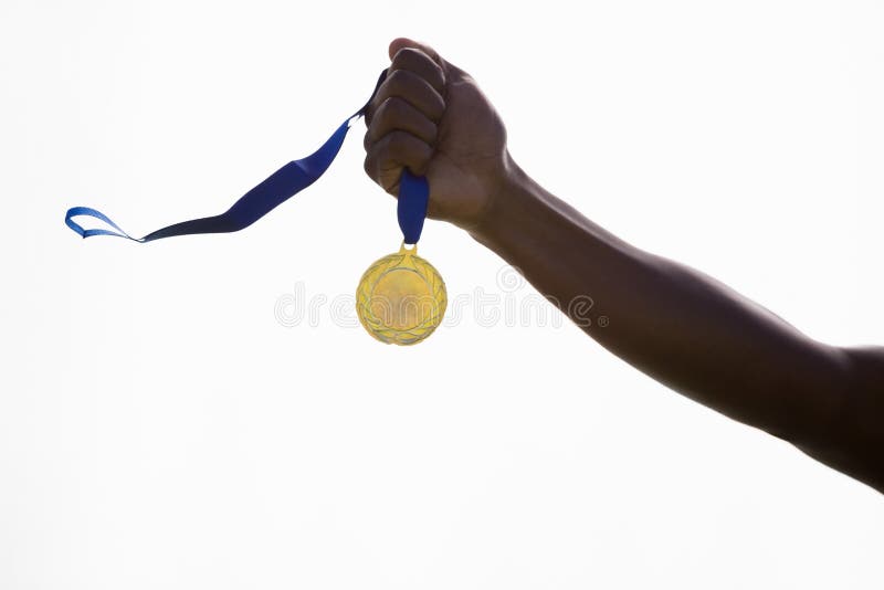 Hand of Athlete Holding Gold Medal Stock Image - Image of olympic ...