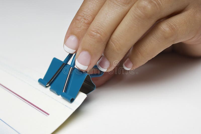 Hand Attaching Paper Binder Clip Stock Photo - Image of paperclip ...