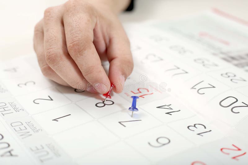 Man Hand with Calendar and Black Marker. Concept Mark on the Calendar ...
