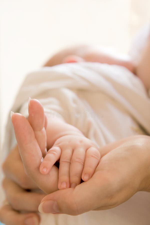 Female Hand Holding Her Newborn Baby`s Hand. Mom with Her Child ...