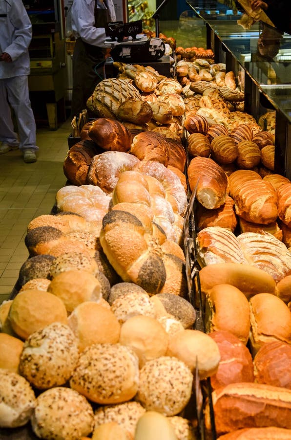Hand of Baker or Apprentice Baker Taking Baguettes Out of Oven Stock ...