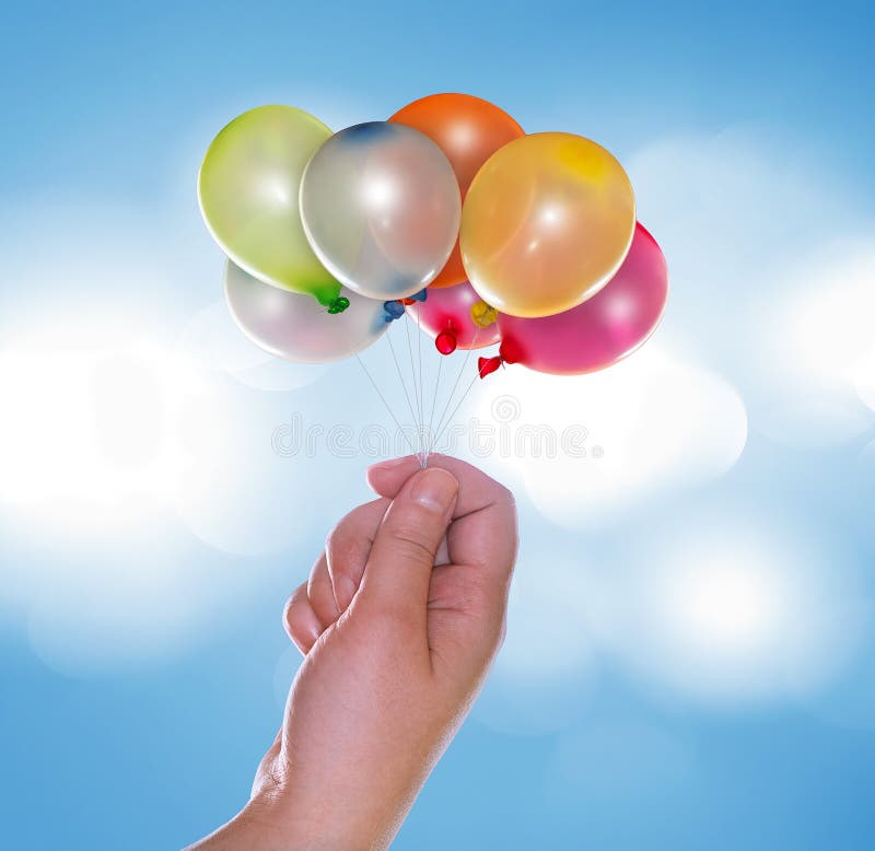 Hand with balloons stock photo. Image of colorful, present - 53623166