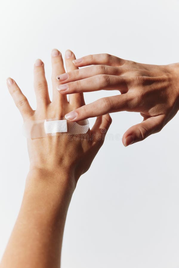 Hand with Bandage Being Reached for by Another Hand Stock Photo - Image ...