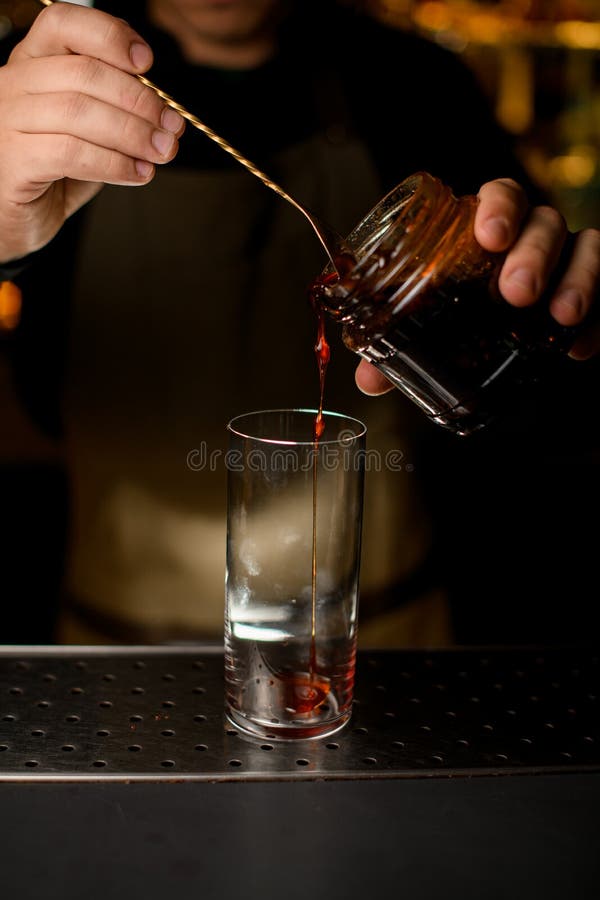 Hand of the Bartender Gently Pours Syrup with a Spoon into a ...
