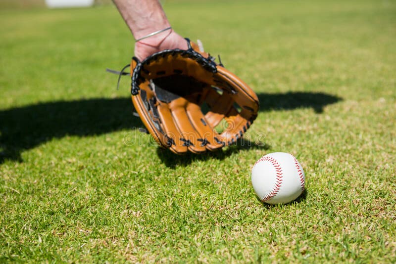 Hand of Baseball Pitcher by Ball on Field Stock Photo - Image of green ...