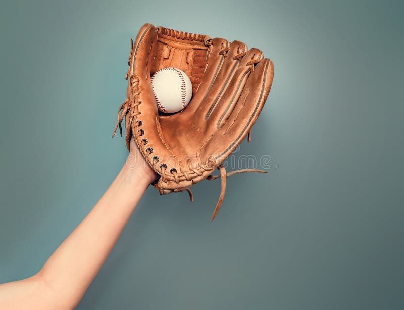 The Hand of a Baseball Player Catches a Game Ball with a Glove Stock ...