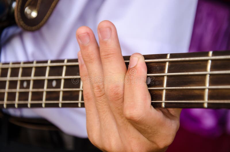 Hand for bass guitar stock image. Image of fingerboard - 41508553