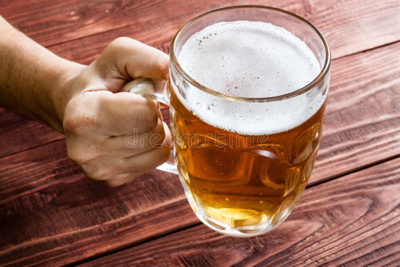 Hand with beer glass stock image. Image of nature, beverage - 56982595
