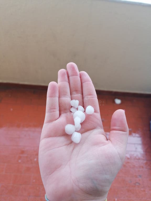 Hand with big hail stock image. Image of hands, weather - 249629297