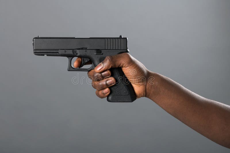 Hand of a Black Man Holding a Handgun Stock Image - Image of person ...