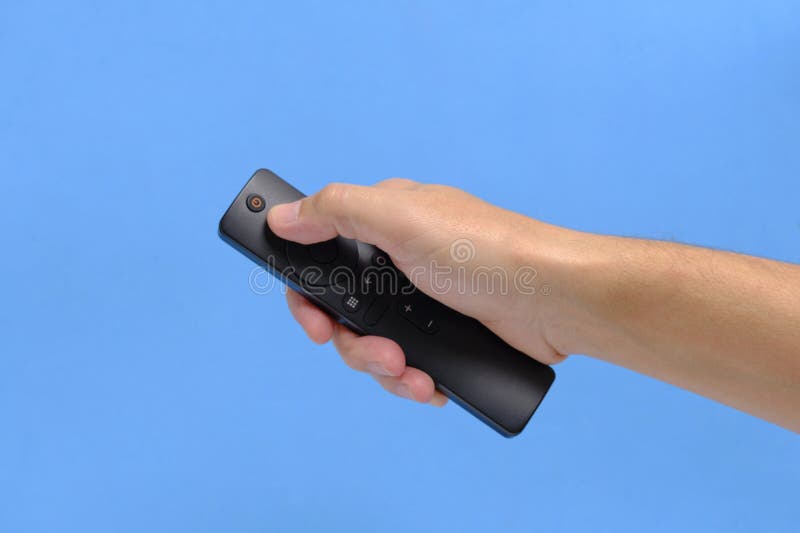 Hand Blue Background Holds TV Remote by Pressing Button with Finger ...