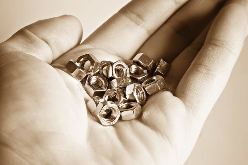 Hand with bolts and nuts stock photo. Image of bolt, industrial - 9702106