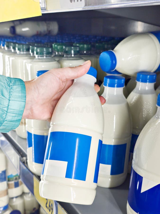Hand with bottle of milk stock photo. Image of dairy - 343219030