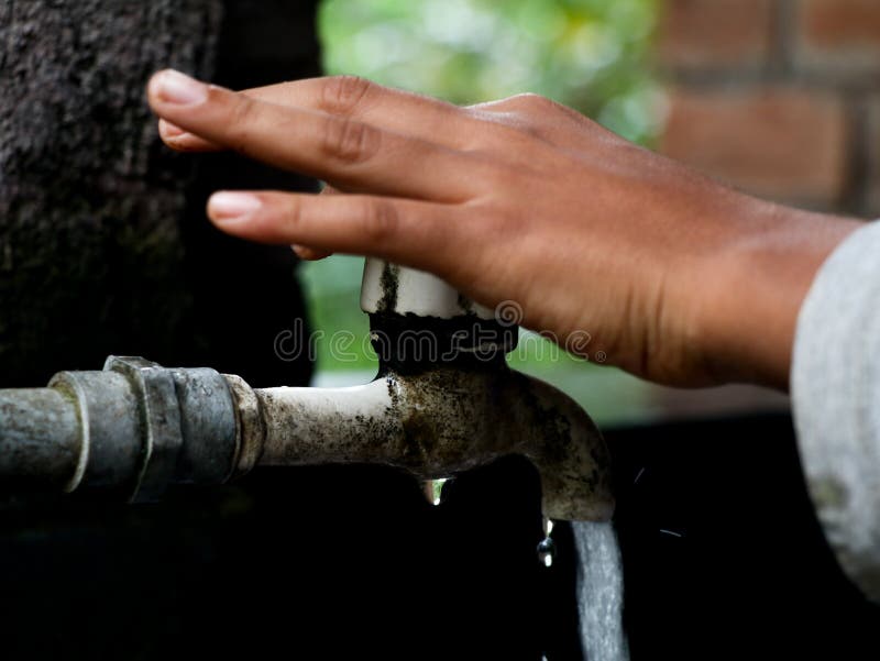 Hand of a Boy Turning on an Old Plastic Water Tap Stock Photo - Image ...
