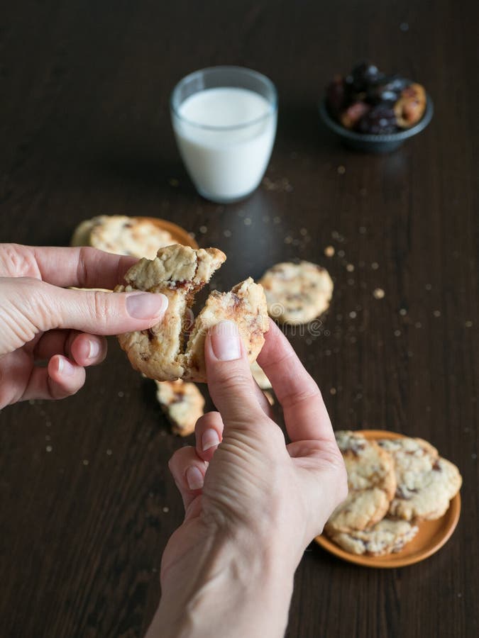 Hand Breaks Fresh Delicious Date Cookies Stock Photo - Image of crispy ...
