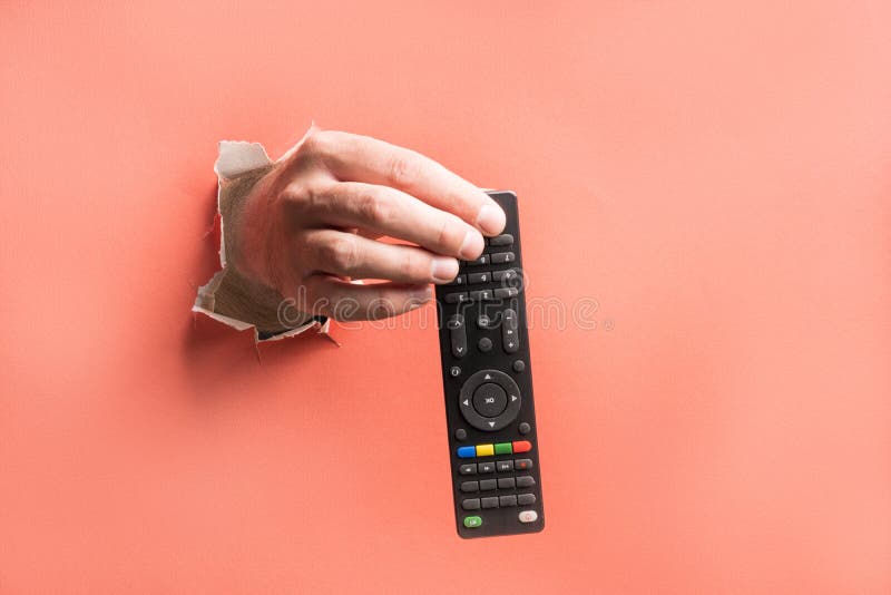 The Hand Breaks through the Paper and Demonstrates the Remote Control ...