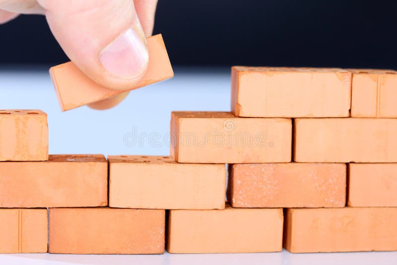 Hand and brick stock image. Image of material, industrial - 84038817