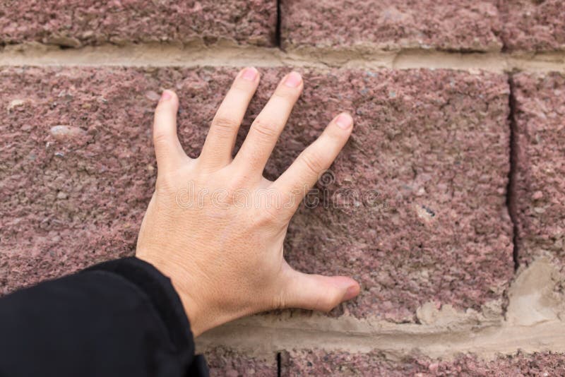 Hand on the brick wall stock image. Image of seminar - 106594789