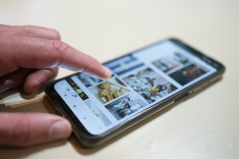 Hand Browsing Christmas Inspirations on Phone Stock Photo - Image of ...