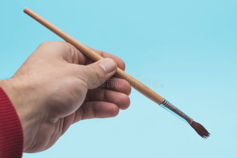 Hand with brush and paint stock image. Image of creativity - 110439279