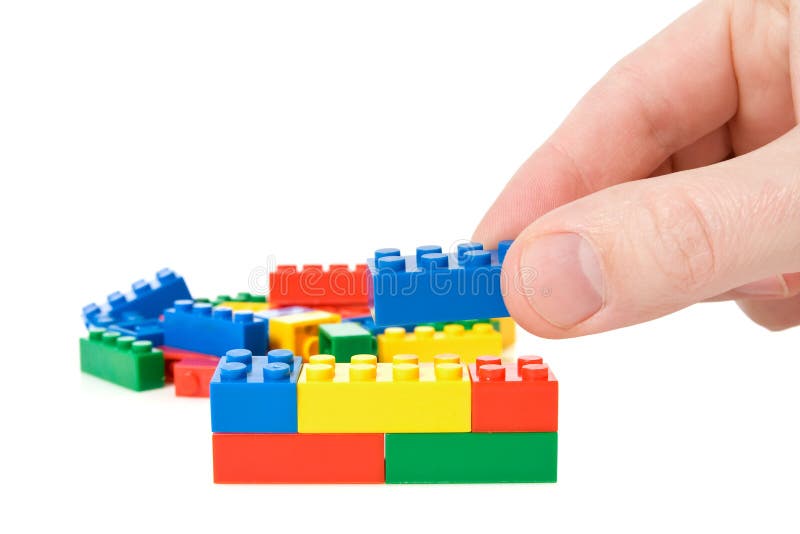 Hand Building Up a Wall by Stacking Up Lego, Business Conception Stock ...