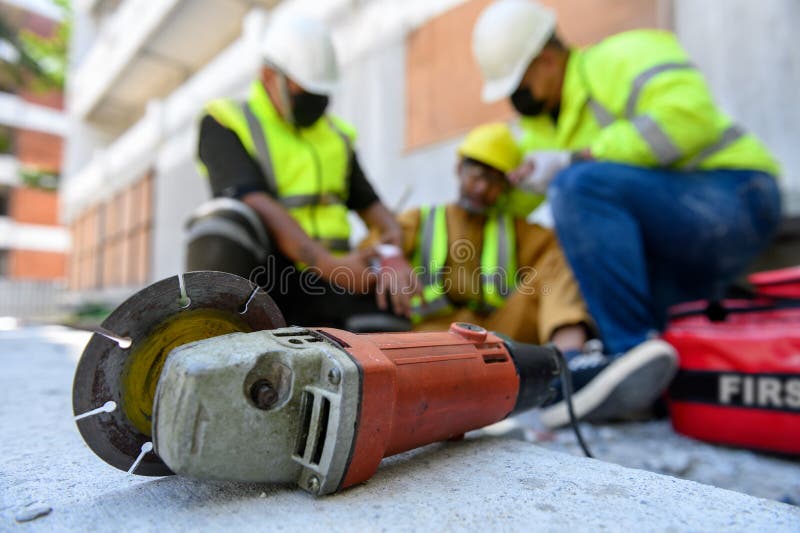 Accident in Industrial Work with First Aid Stock Photo - Image of ...
