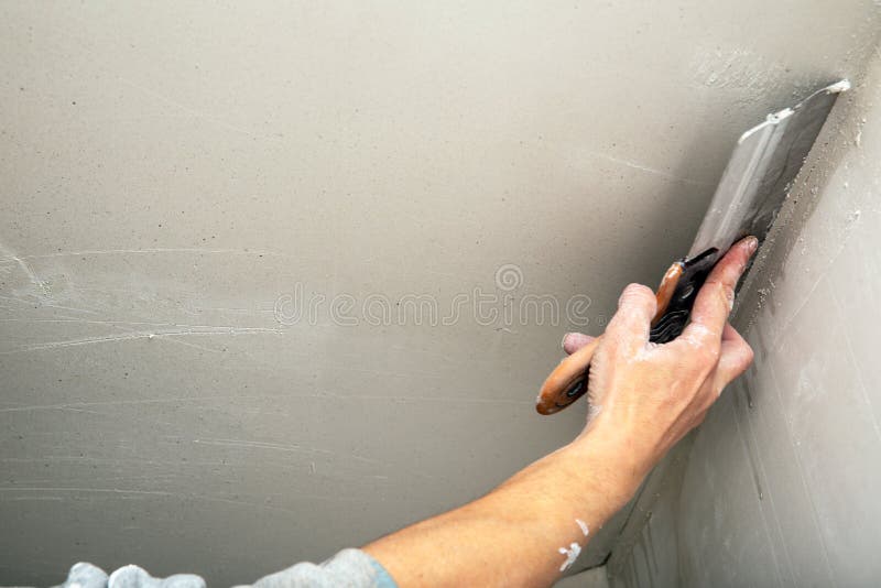 Hand of Builder Worker Spacks Ceiling with Putty Plaster Aligning ...