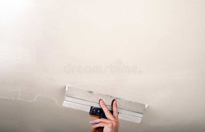 Hand of Builder Worker Spacks Ceiling with Putty Plaster Aligning ...