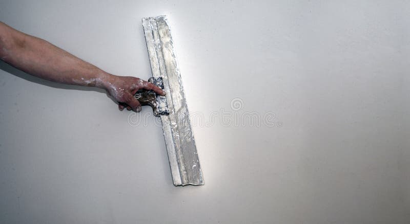 Hand of Builder Worker Spacks Ceiling with Putty Plaster Aligning ...