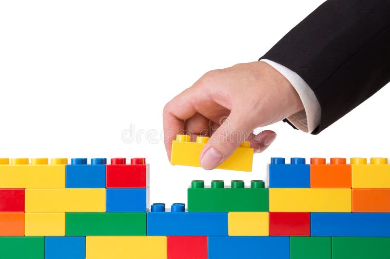 Hand Building Up a Wall by Stacking Up Plastic Block Stock Image ...