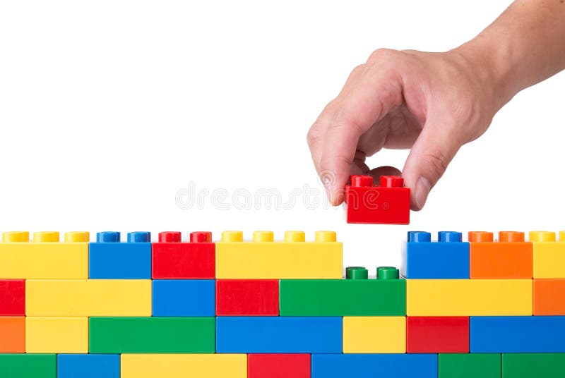 Hand Building Up a Wall by Stacking Up Plastic Block Stock Image ...