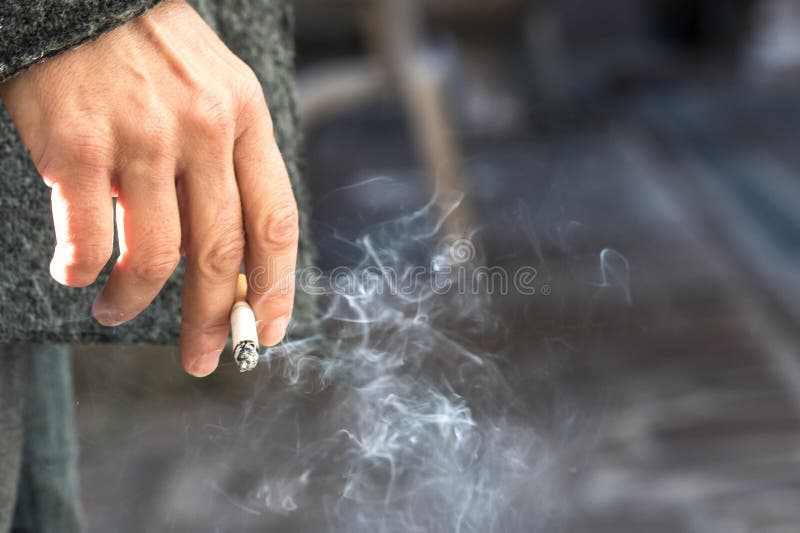 Hand with Burning Cigarette Stock Photo - Image of burning, addiction ...