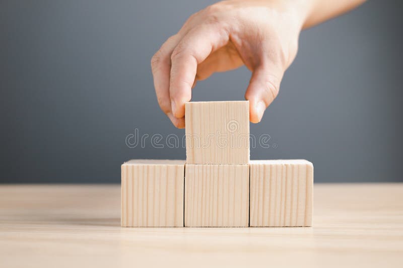 Hand of a Businessman Stacking Wood Empty Four Blocks with Copy Space ...